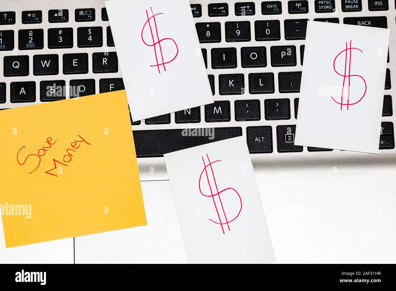 Text on colorful sticky note with Save money and white labels with ...