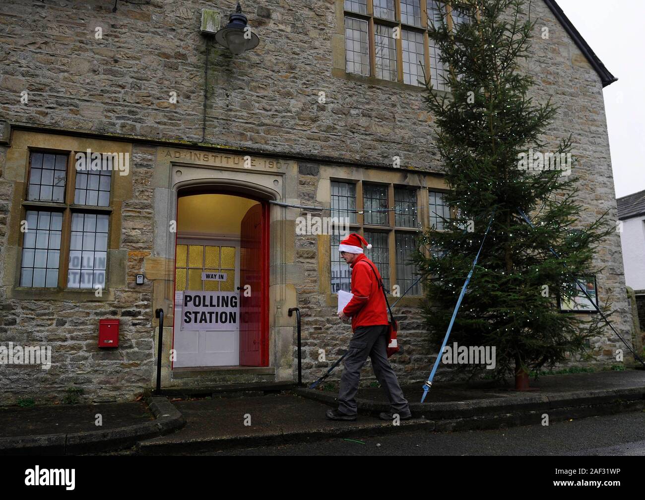 Yorkshire Dales postman Andrew Pilkington wearing a santa hat as he ...