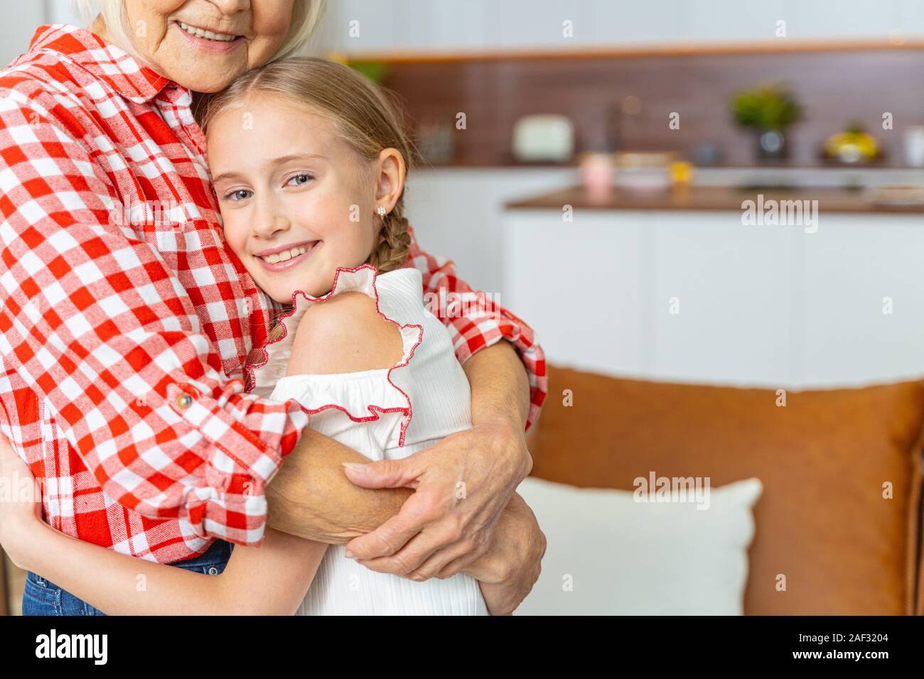 Pleased cute girl smiling at the camera Stock Photo - Alamy