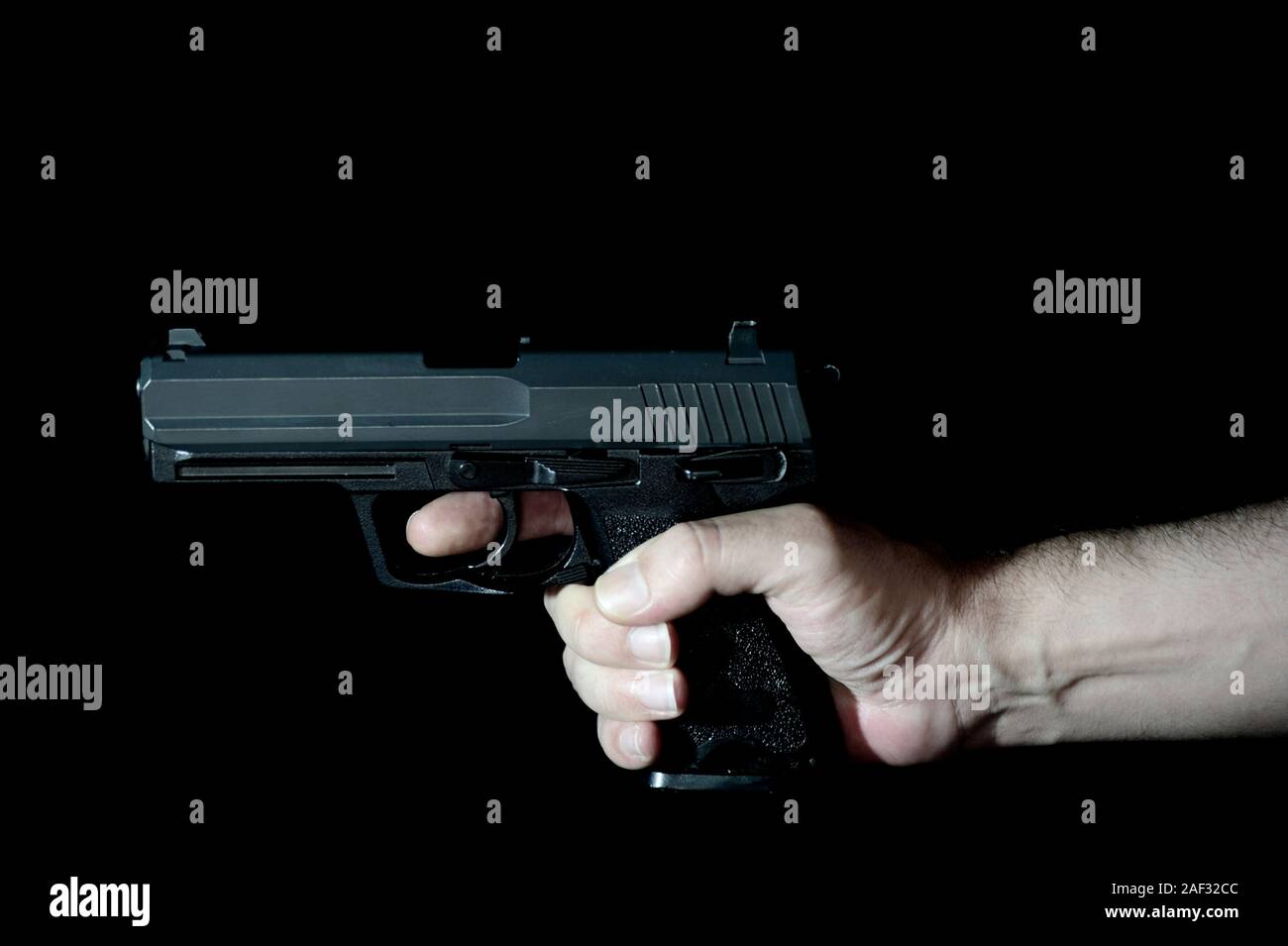 Mans Hand Holding Gun High Resolution Stock Photography and Images - Alamy
