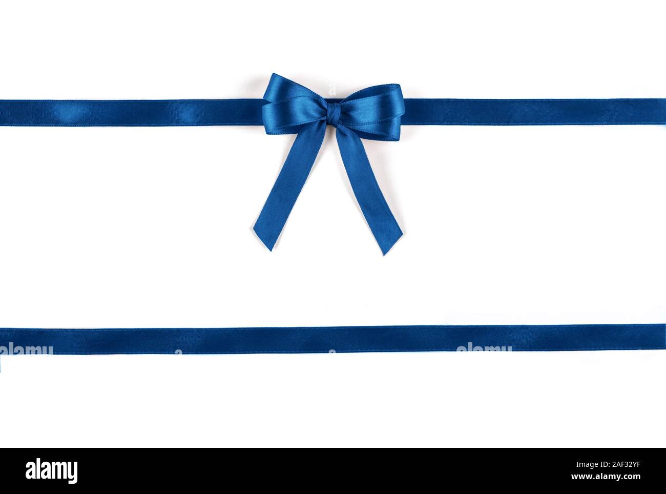 Shiny blue silk ribbon isolated on white background. Festive concept ...