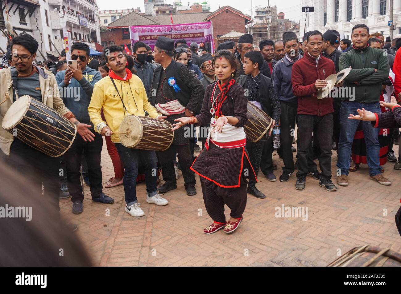 A woman from Newar community dressed in traditional attire dances ...
