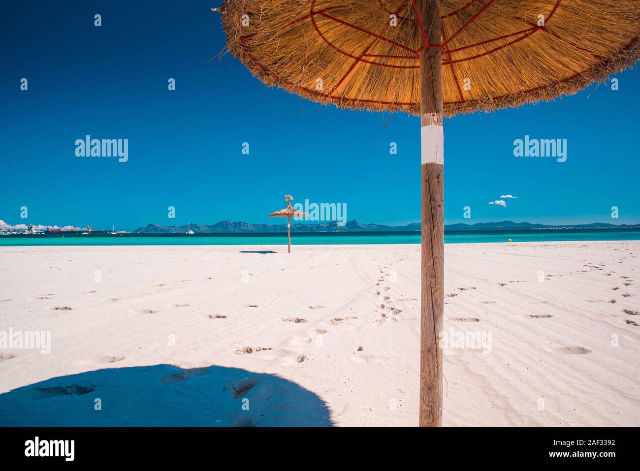 parasol beach on the coast. White sand and blue water of the sea. Playa ...