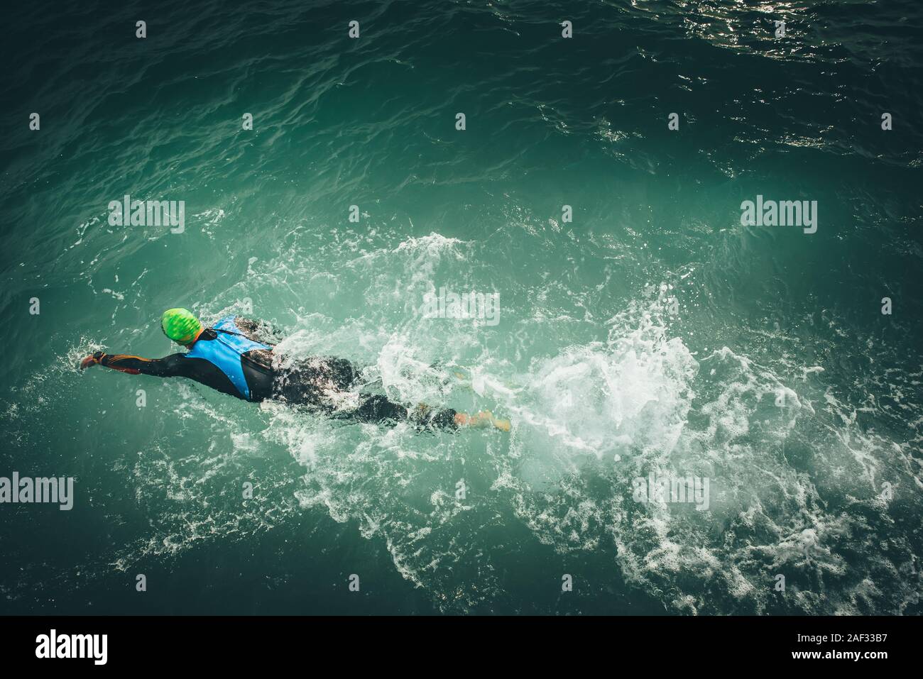 Unknown Swimmer at sea while morning exercise Stock Photo - Alamy