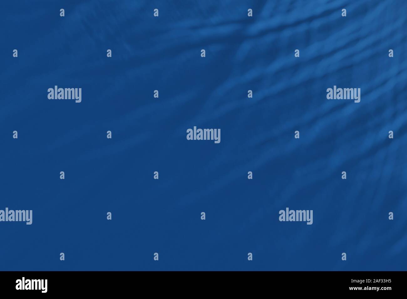 Trendy blue colored low contrast abstract background with light and ...