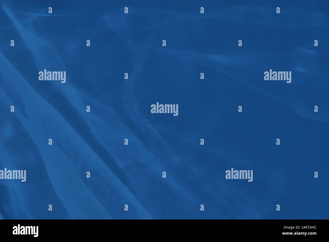 Trendy blue colored low contrast abstract background with light and ...