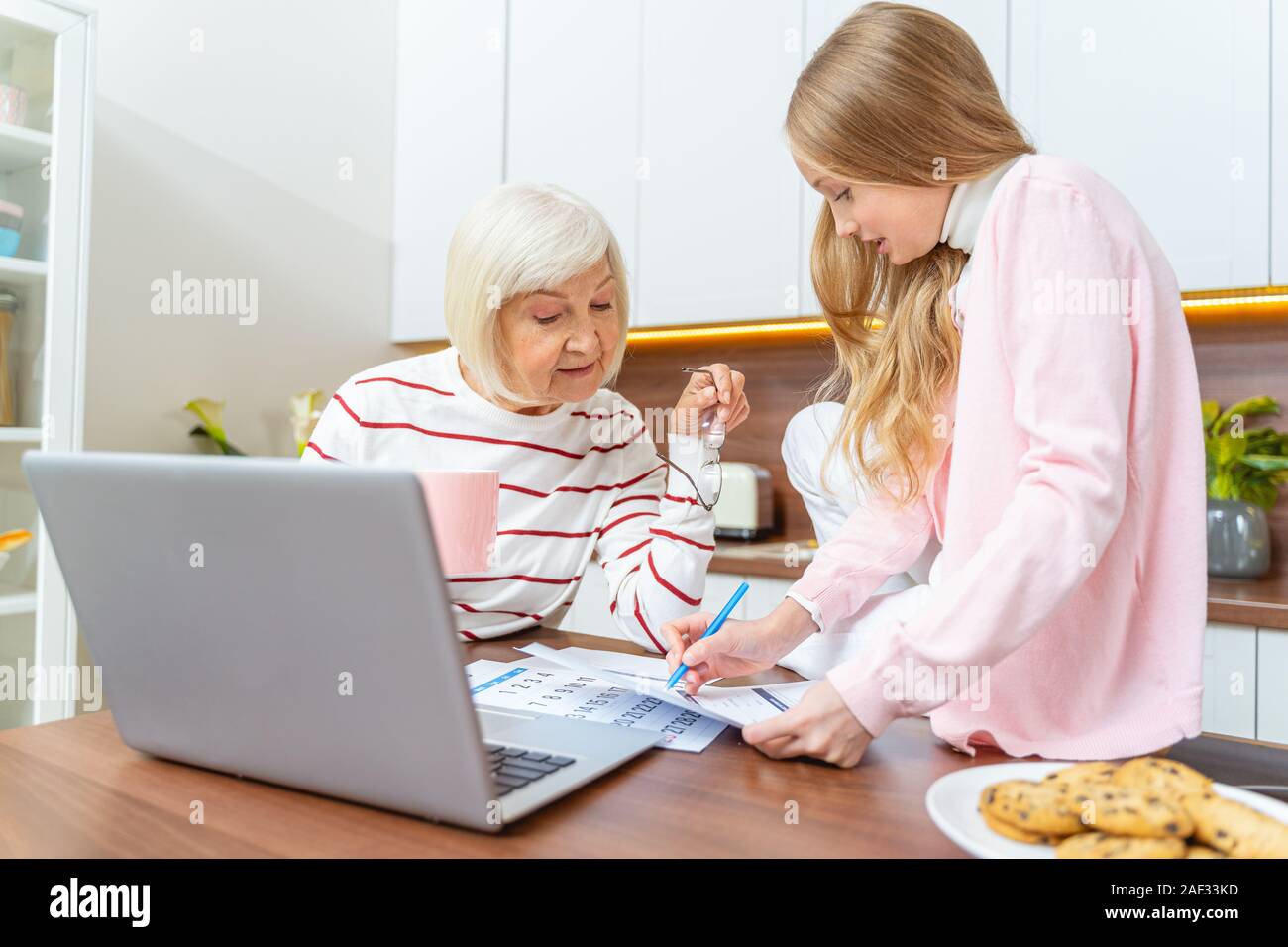 Young lady filling in an application form Stock Photo - Alamy