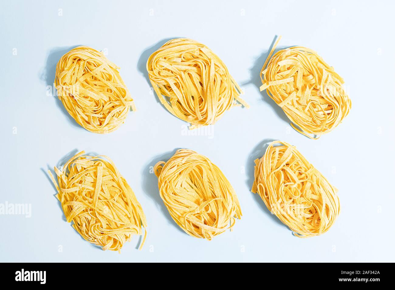 Uncooked pasta nests hi-res stock photography and images - Alamy