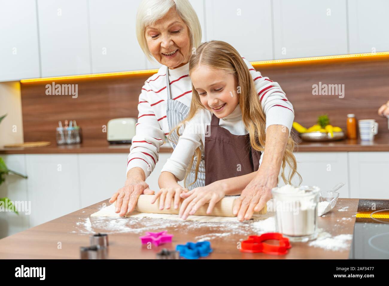 Girl helping elderly lady hi-res stock photography and images - Alamy