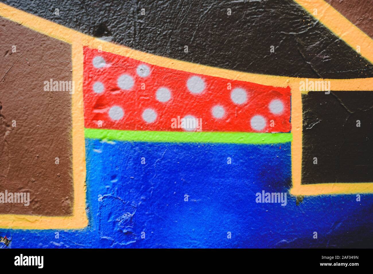 Detail of an anonymous street graffiti with many colors, cheerful urban ...