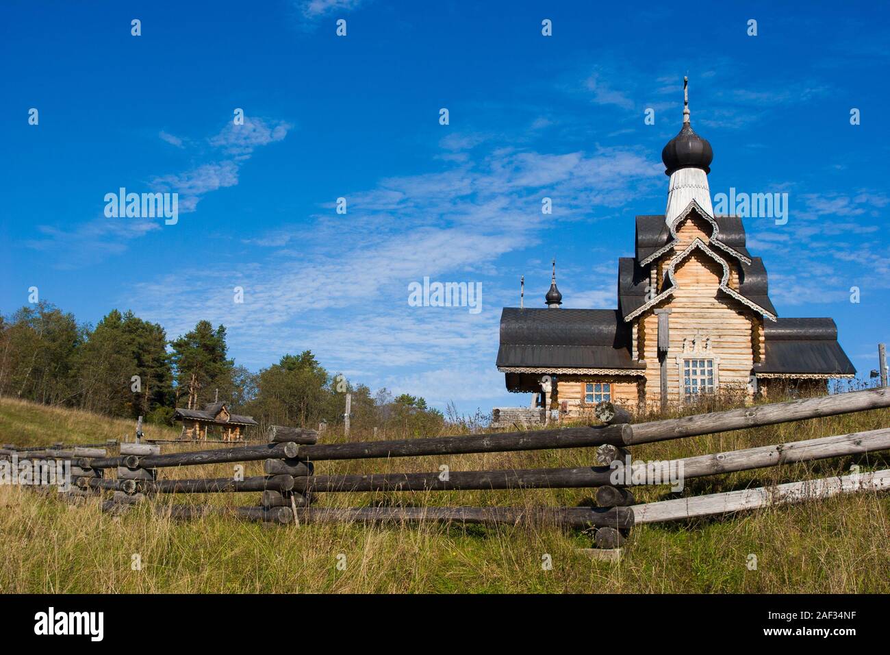 Wooden church behind log fence at Seliger lake, Russia Stock Photo - Alamy