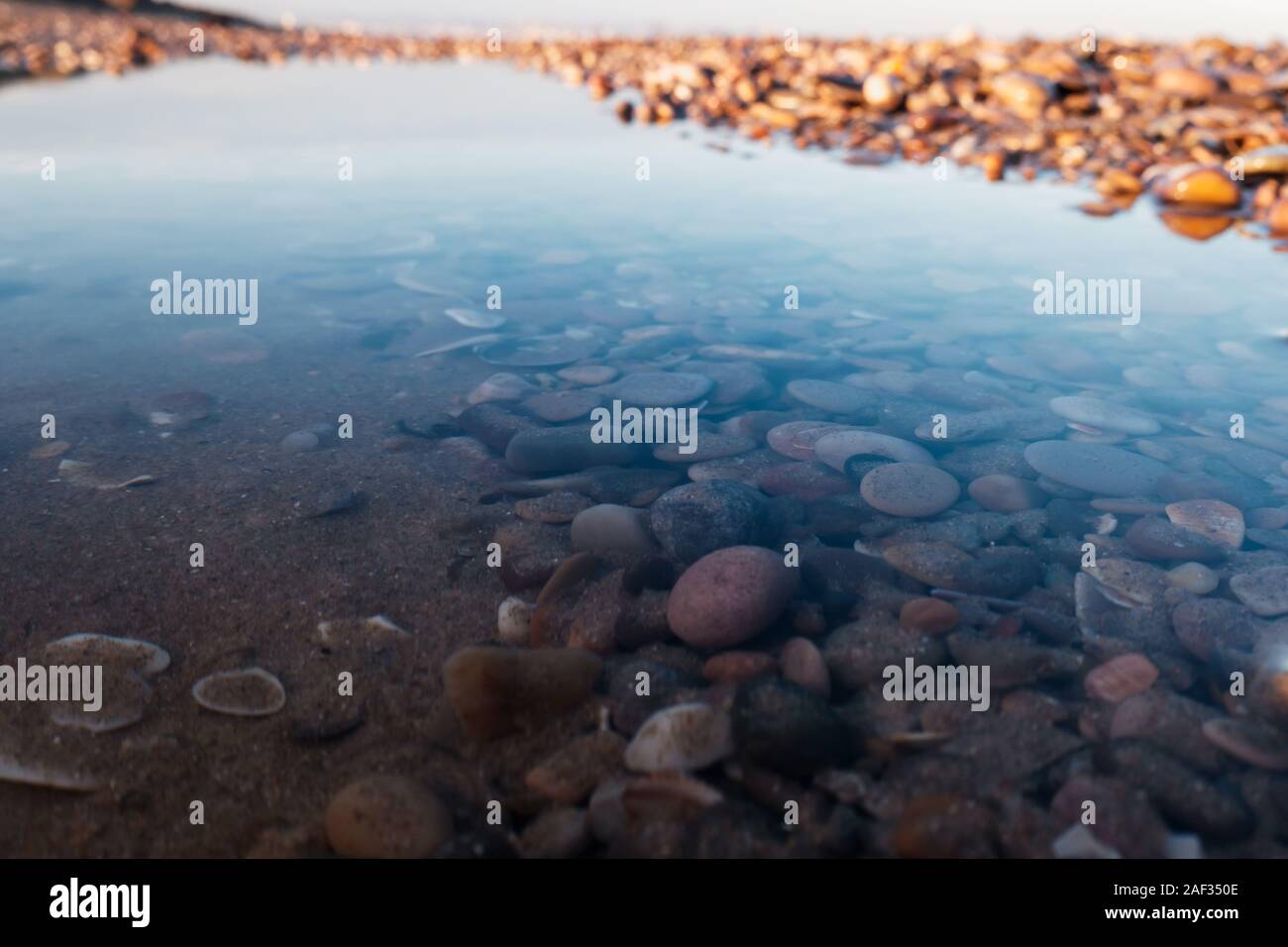 Rock sea sand horizon beach sky puddle hi-res stock photography and ...