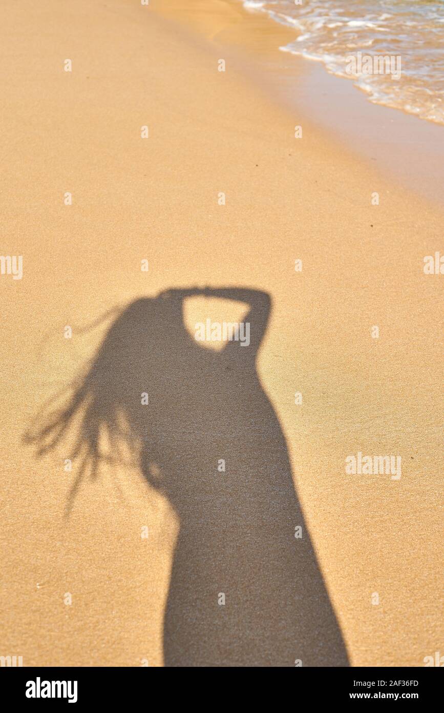 shadow from the photographer girl in the sand, silhouette in the sand ...