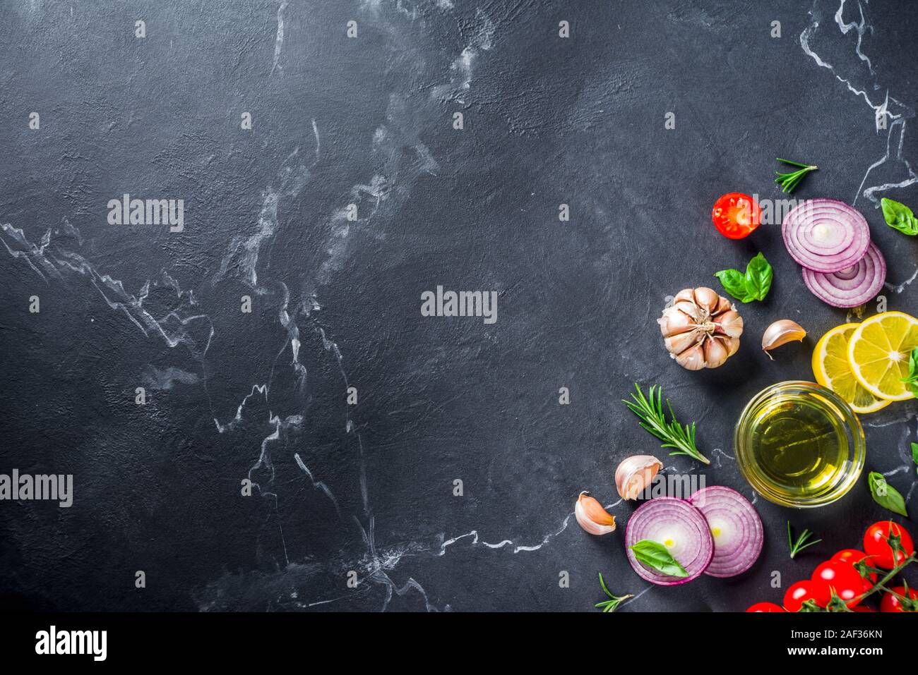 Cooking background with spices, vegetables and herbs fresh basil ...