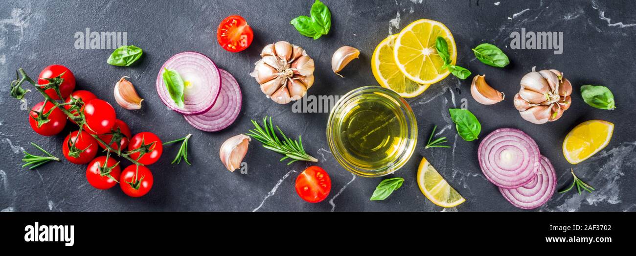 Cooking background with spices, vegetables and herbs fresh basil ...