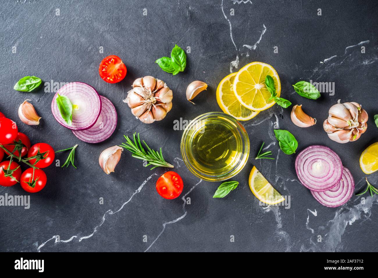 Cooking background with spices, vegetables and herbs fresh basil ...