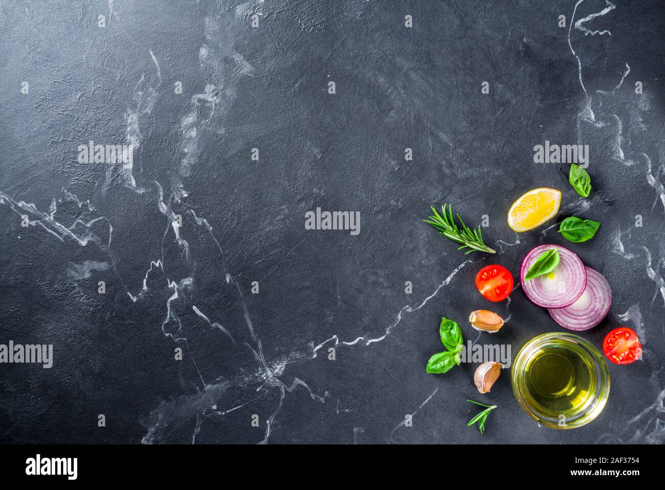 Cooking background with spices, vegetables and herbs fresh basil ...