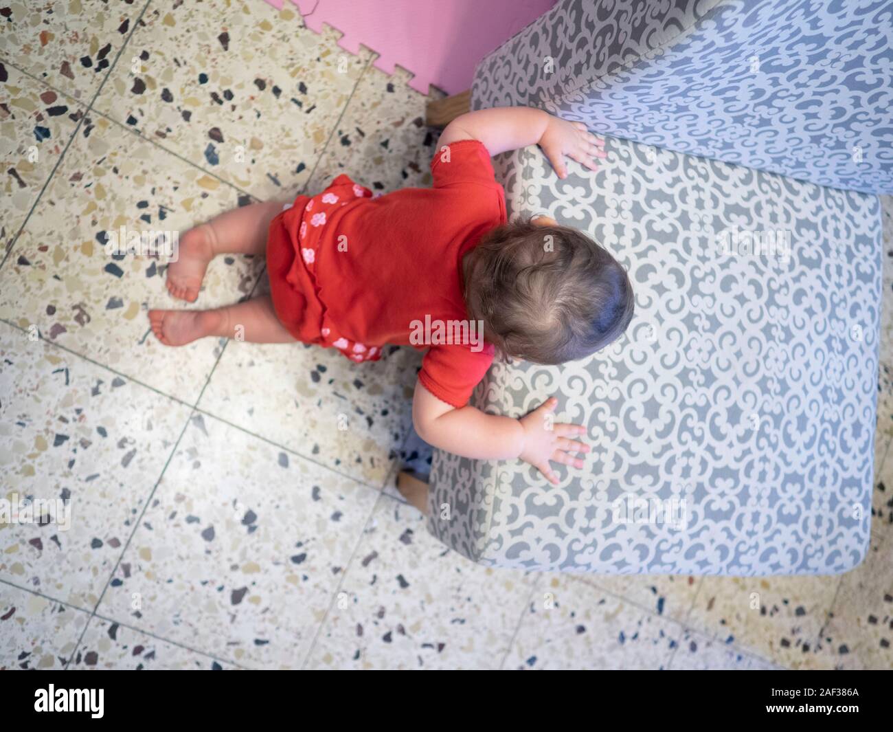 Baby in red hi-res stock photography and images - Alamy