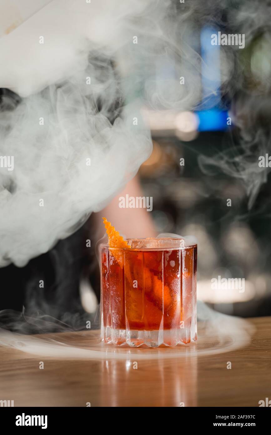 Boulevardie cocktail on a bar desk. Bright background Stock Photo - Alamy