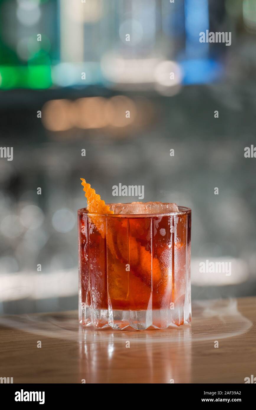 Boulevardie cocktail on a bar desk. Bright background Stock Photo - Alamy