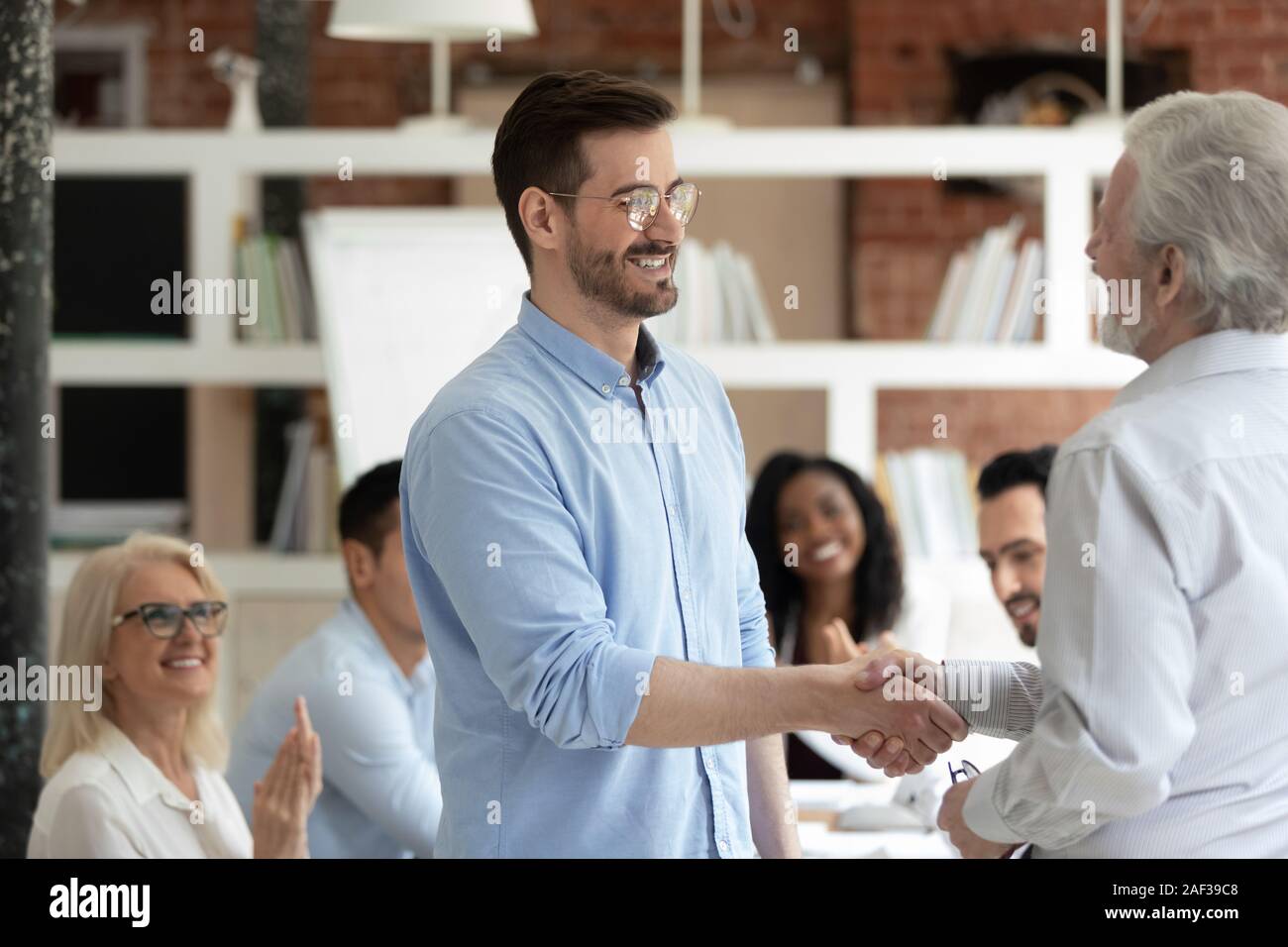 Welcoming new employee hi-res stock photography and images - Alamy