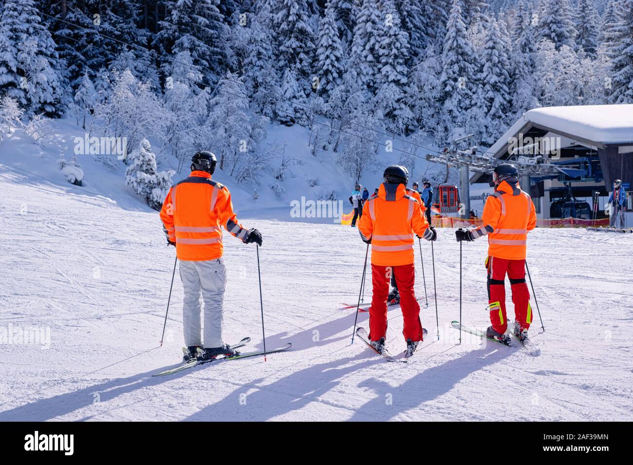 Emergency rescue team in orange uniform Zillertal Arena Austria Stock ...