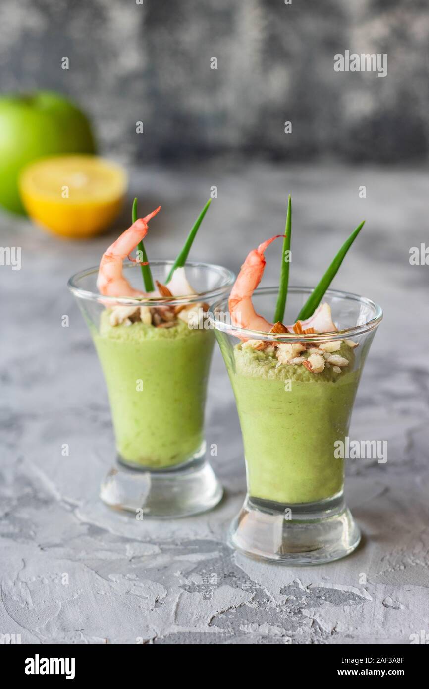 Avocado and green apple mousse with shrimp and almonds. Portion ...