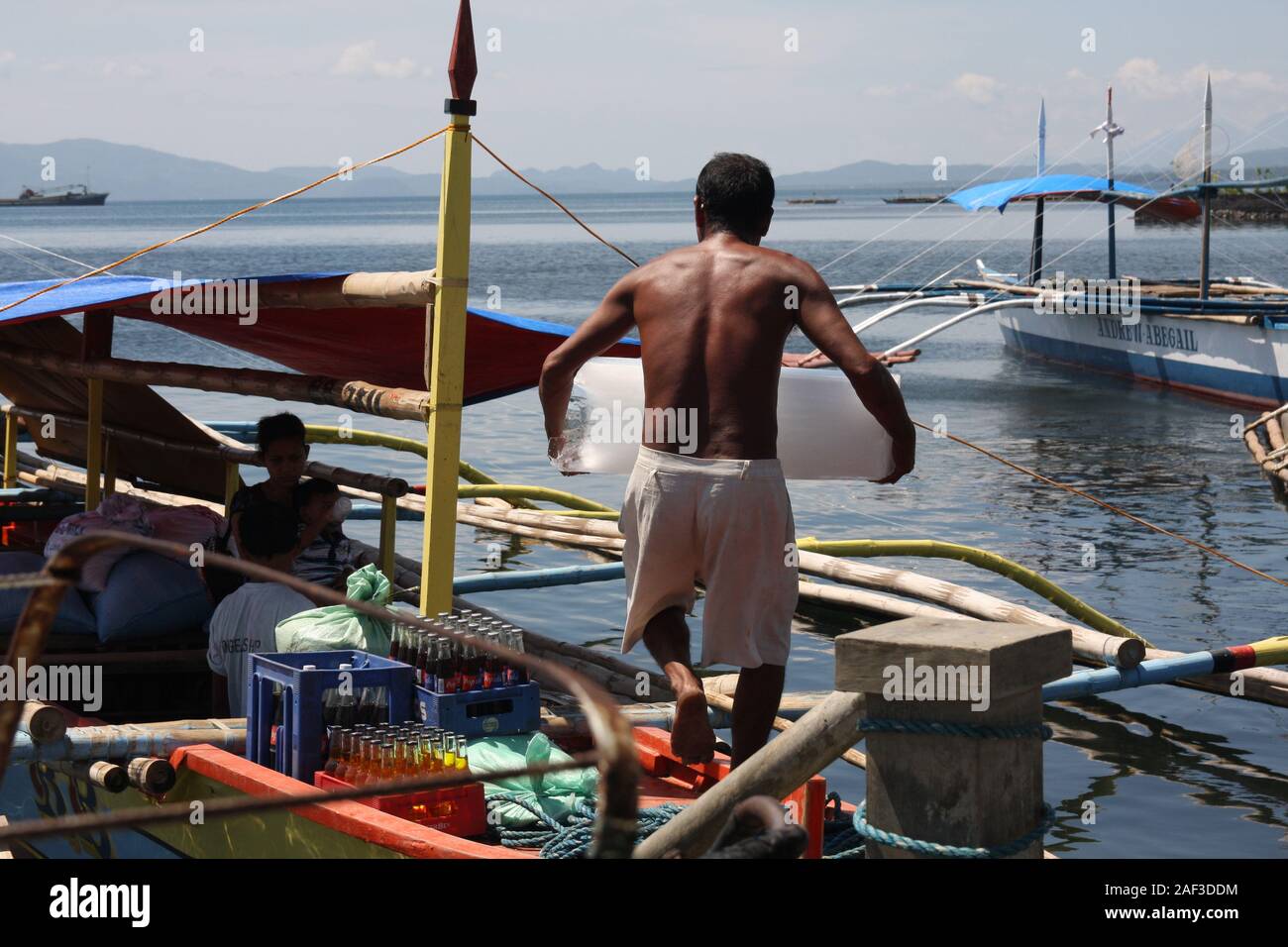 Ice blocks being transported for use of the artisanal Filipino tuna ...