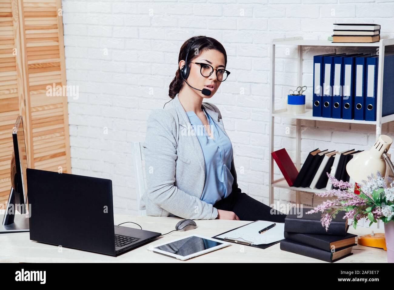 business girl Secretary sits in a white Office call center Stock Photo ...