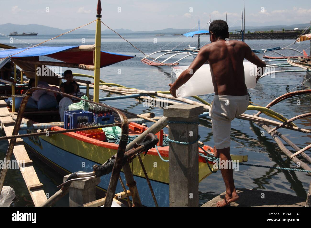 Ice blocks being transported for use of the artisanal Filipino tuna ...