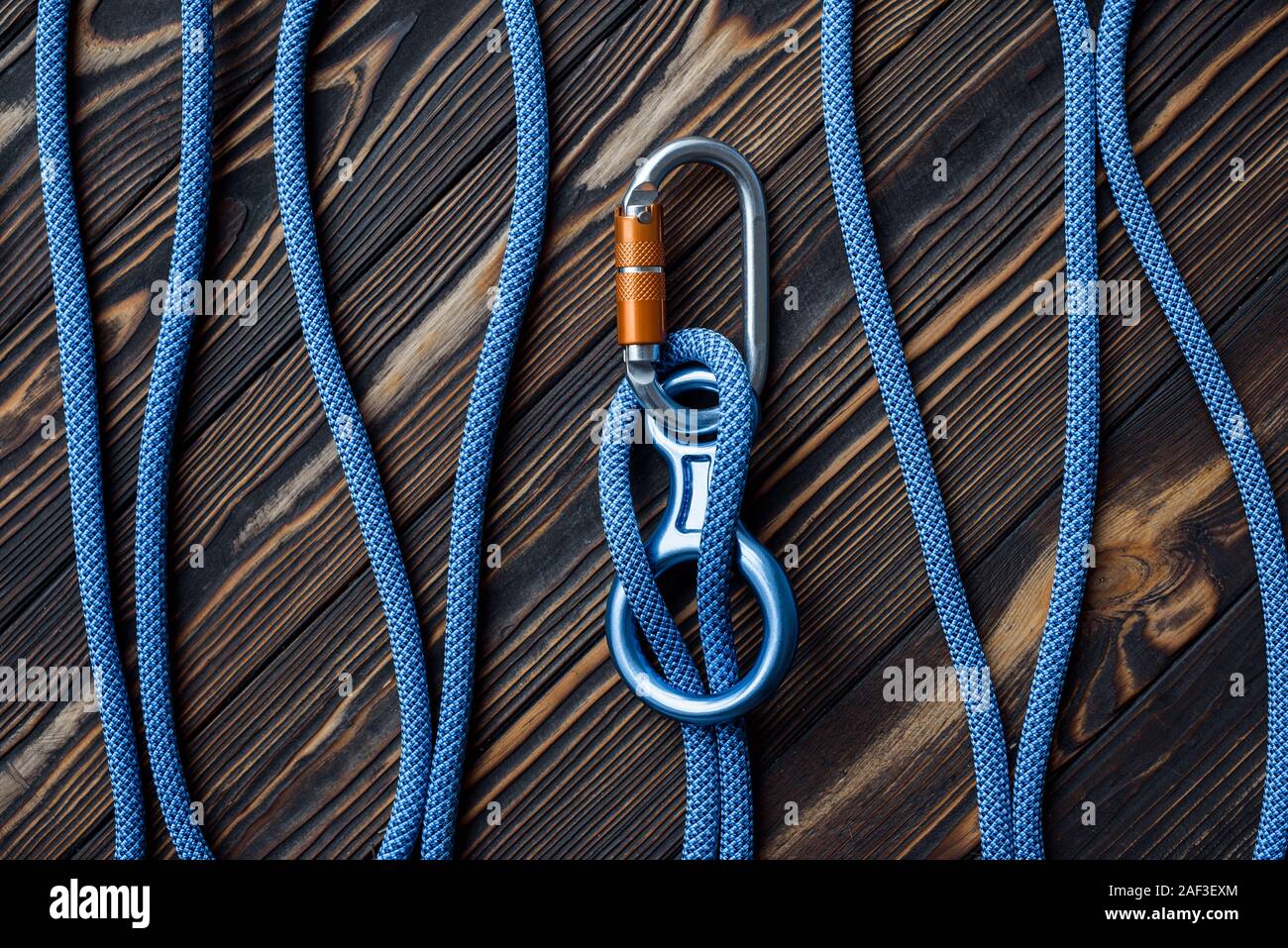 On the wooden table. Isolated photo of climbing equipment. Parts of ...
