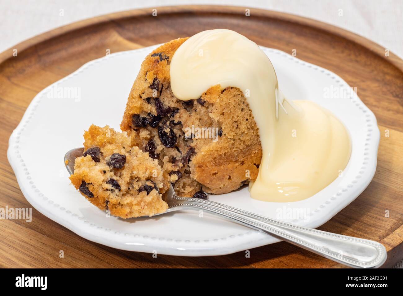 Classic British spotted dick pudding and custard Stock Photo - Alamy