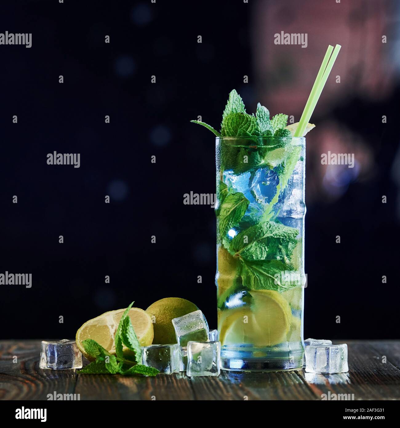 One drink only. Cocktail is ready. On the wooden table in the night ...