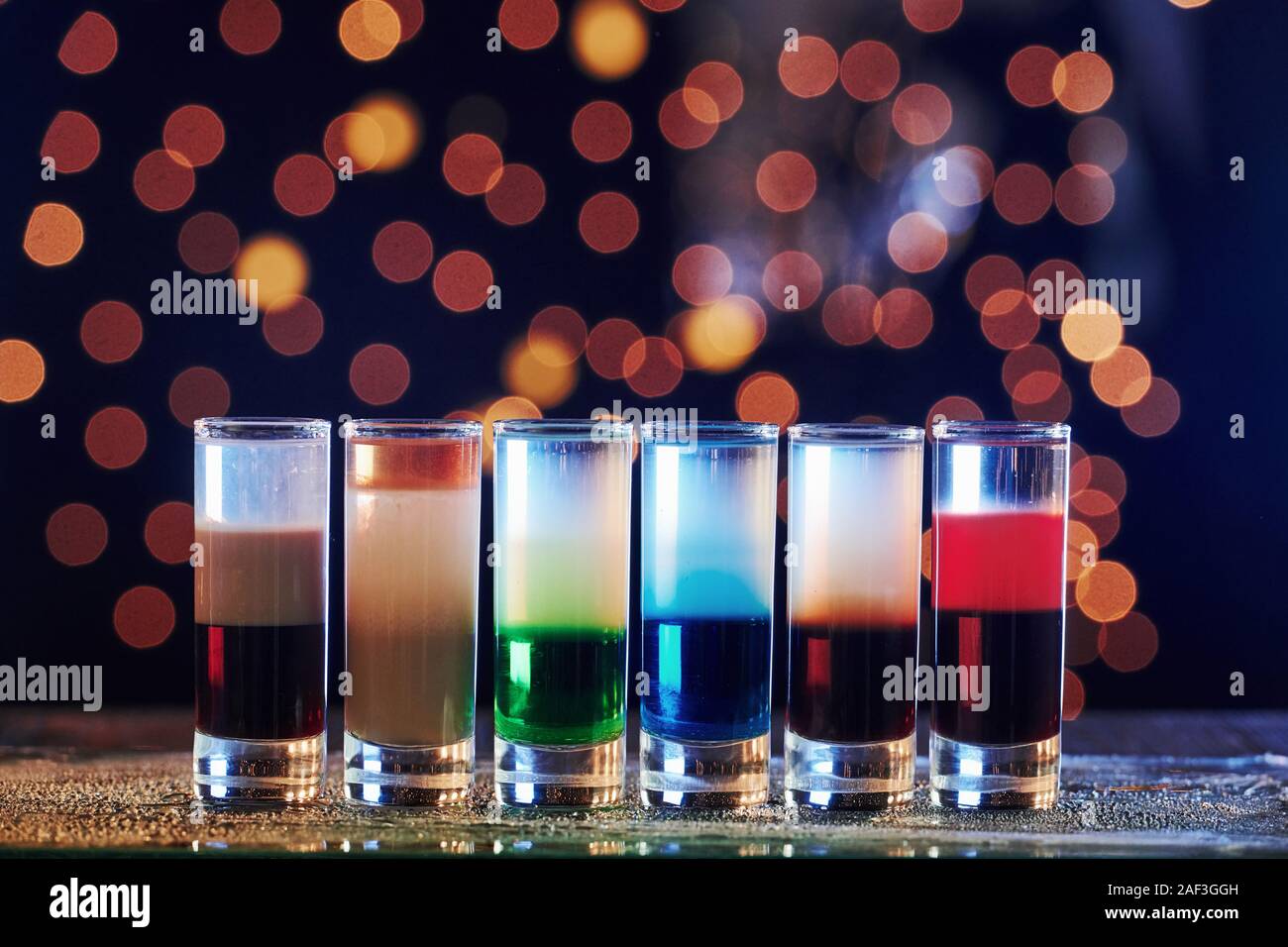 All shots in one picture. Cocktails is ready. On the wooden table in ...