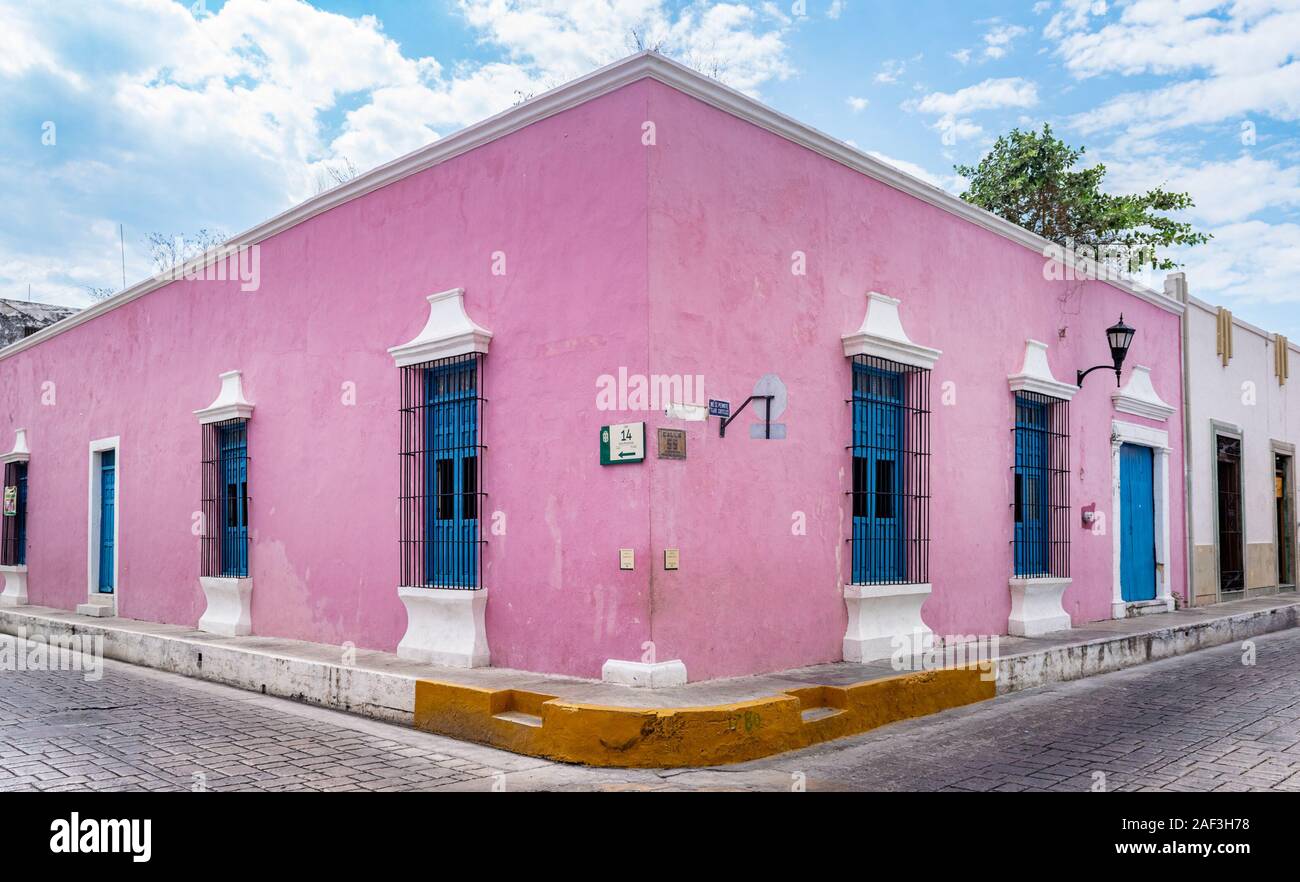 Pink colonial building on a street corner in Campeche, a small town on ...