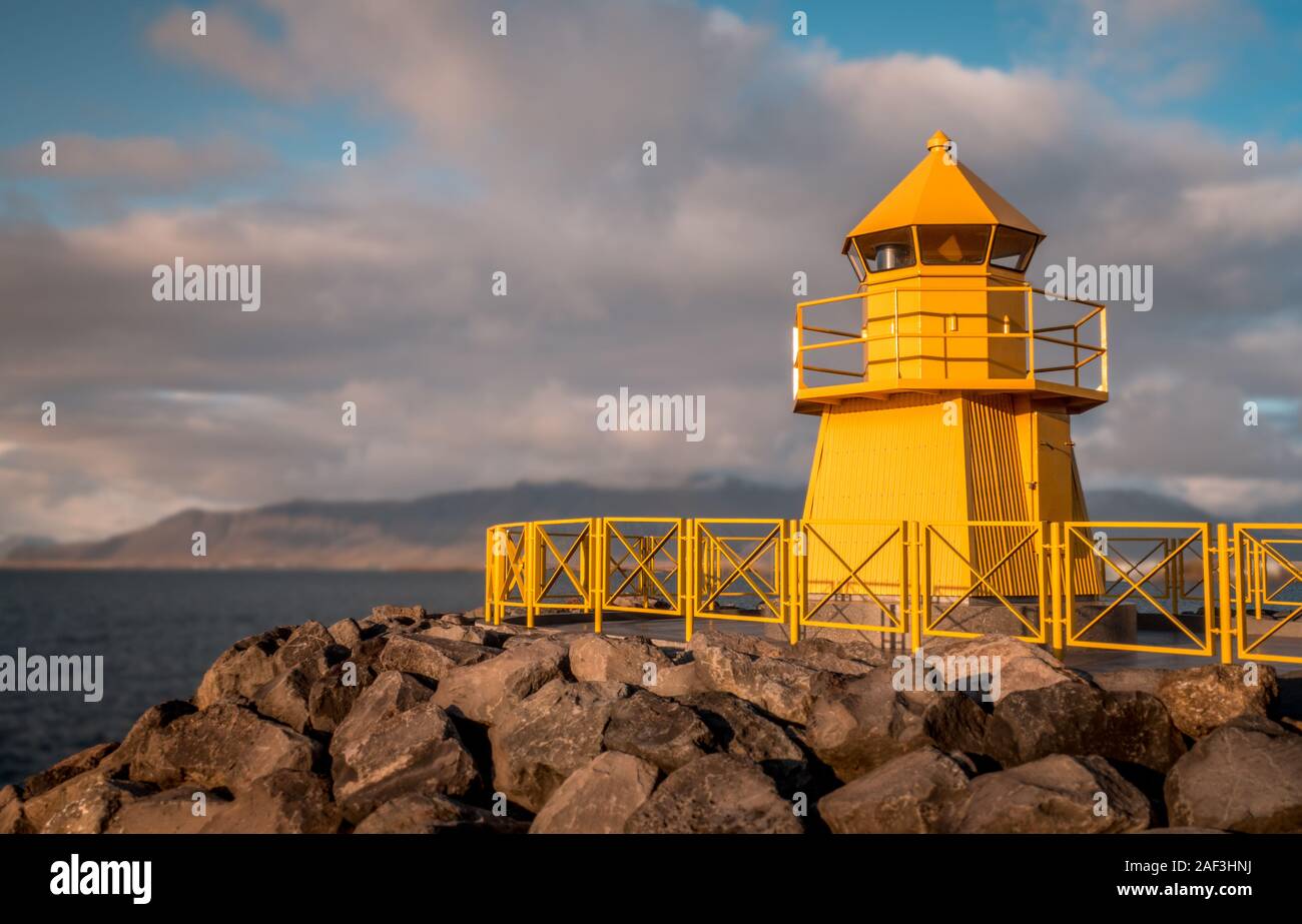 Beautiful yellow lighthouse in Reykjavik Bay during the evening Stock ...