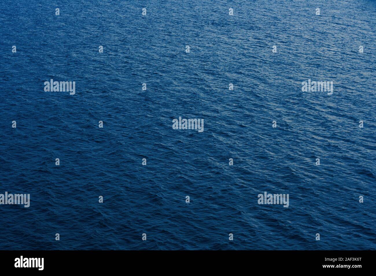 Abstract blue calm sea or ocean water surface background. Classic blue ...