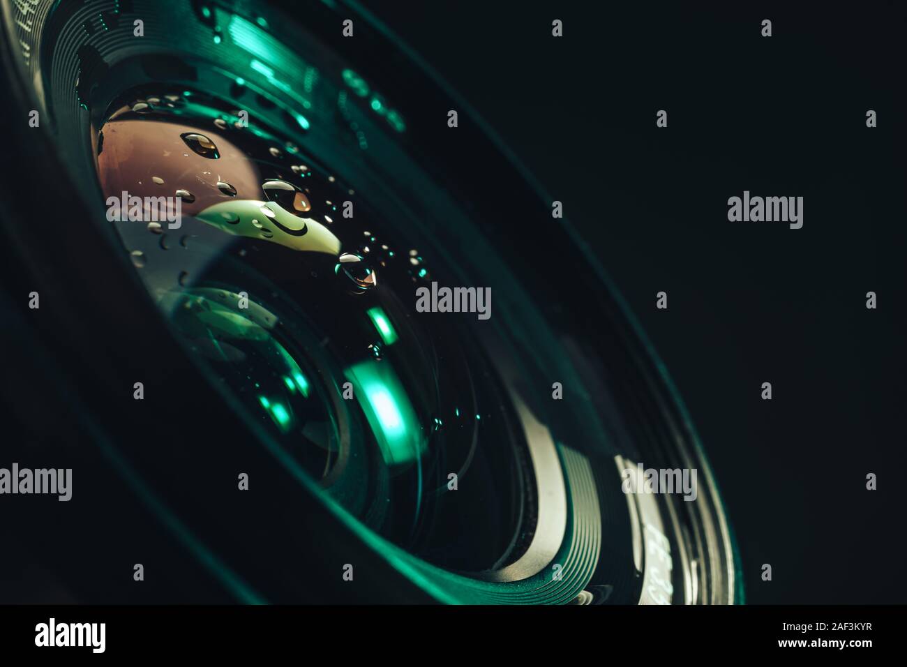 Close up beautiful Camera lens of drop water, aqua menthe light on a ...