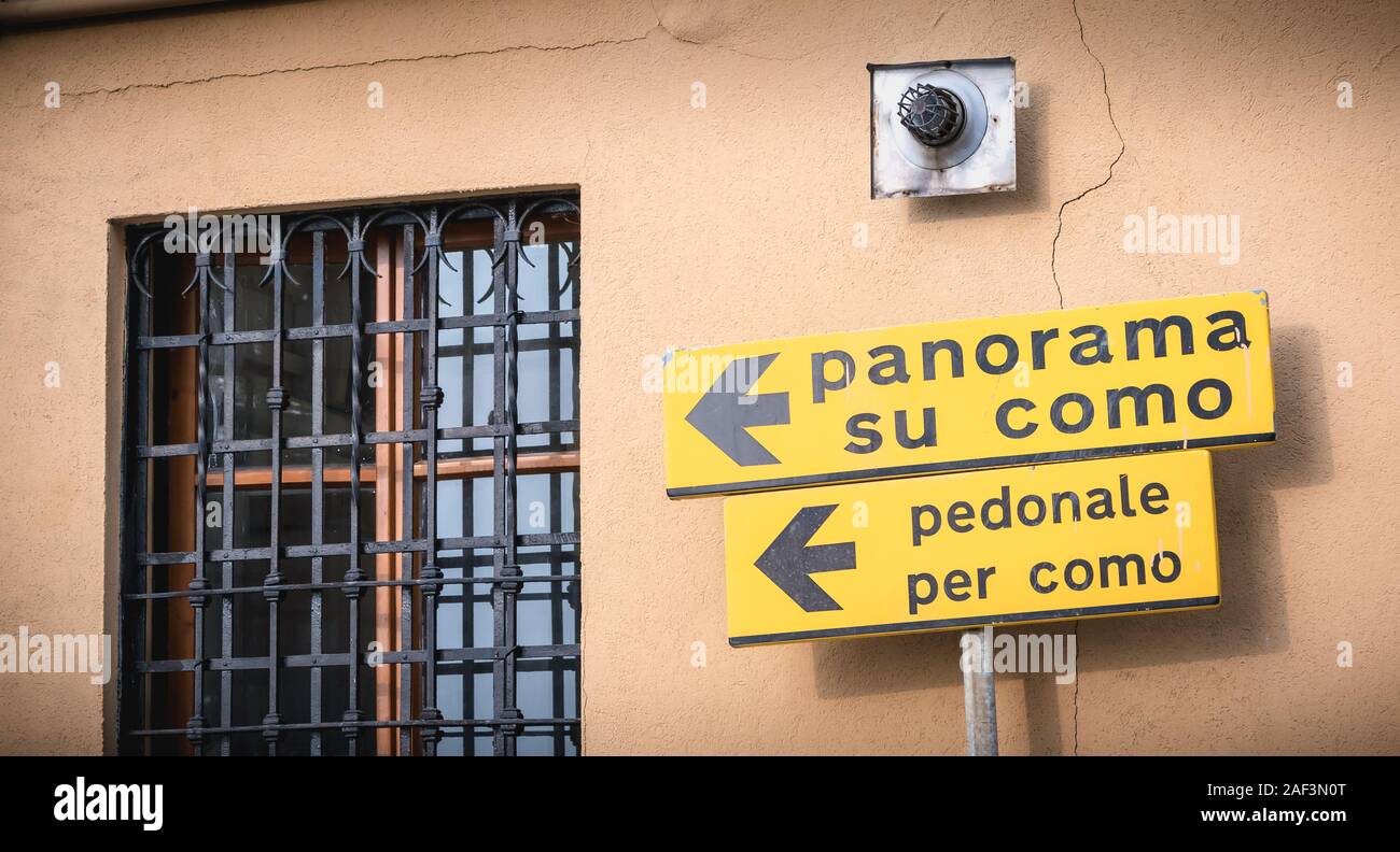 Como, Italy - November 4, 2017: yellow road sign indicating in Italian ...