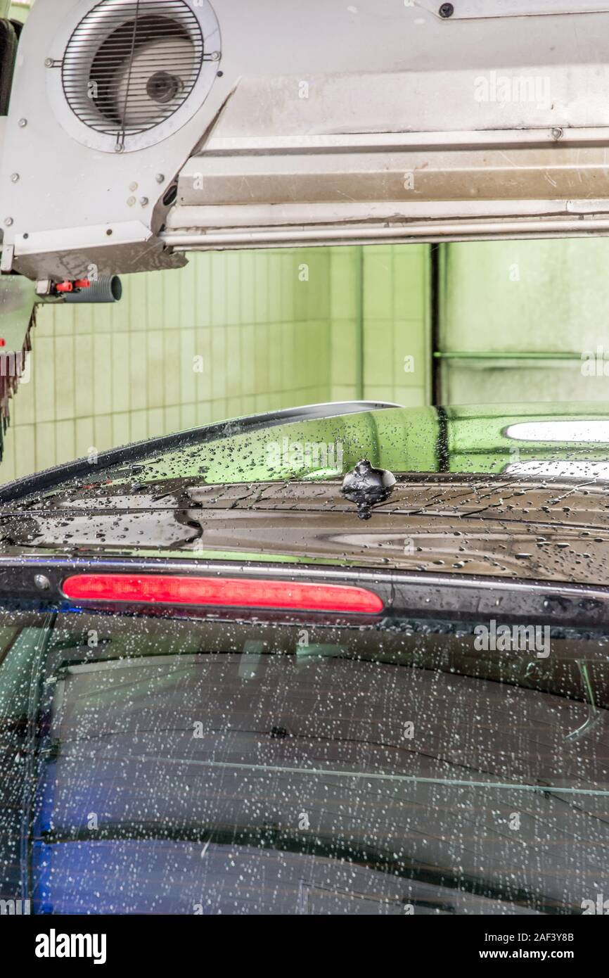 Car is dried after washing in a car wash Stock Photo - Alamy