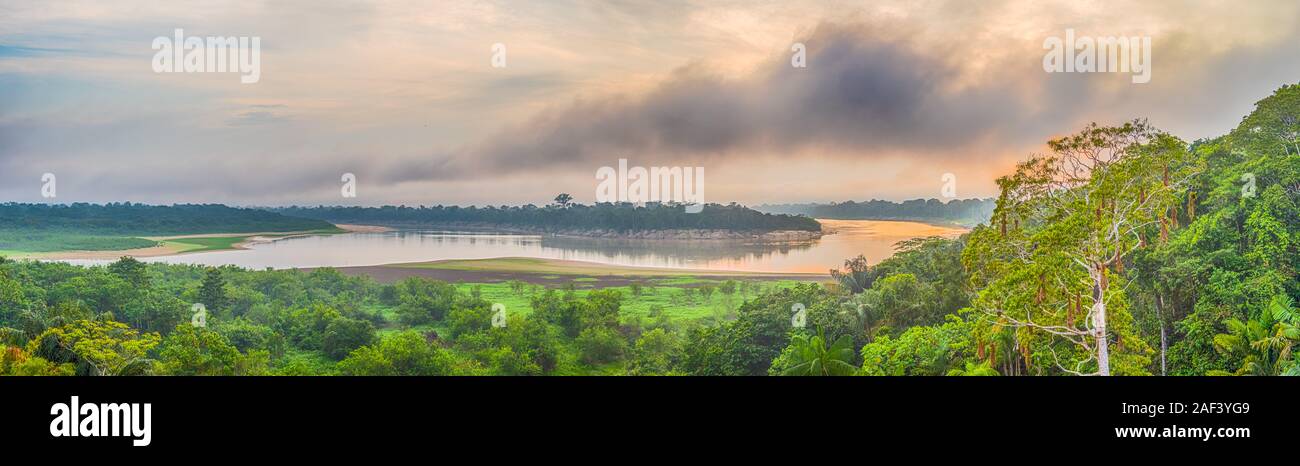 Sunset at the Javari River, the tributary of the Amazon River, Amazonia ...