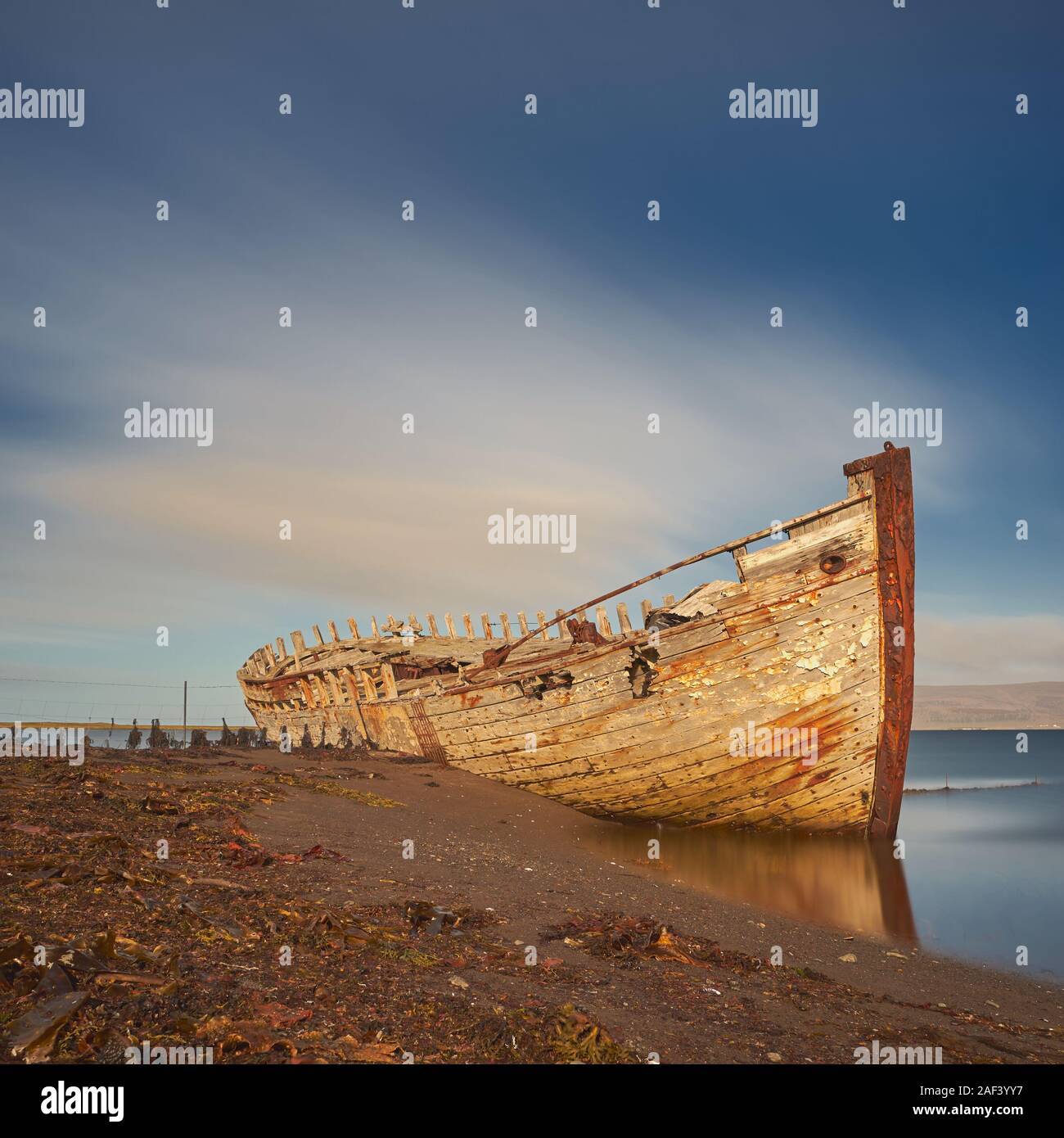 A stranded old wooden boat. It is already very weathered Stock Photo ...