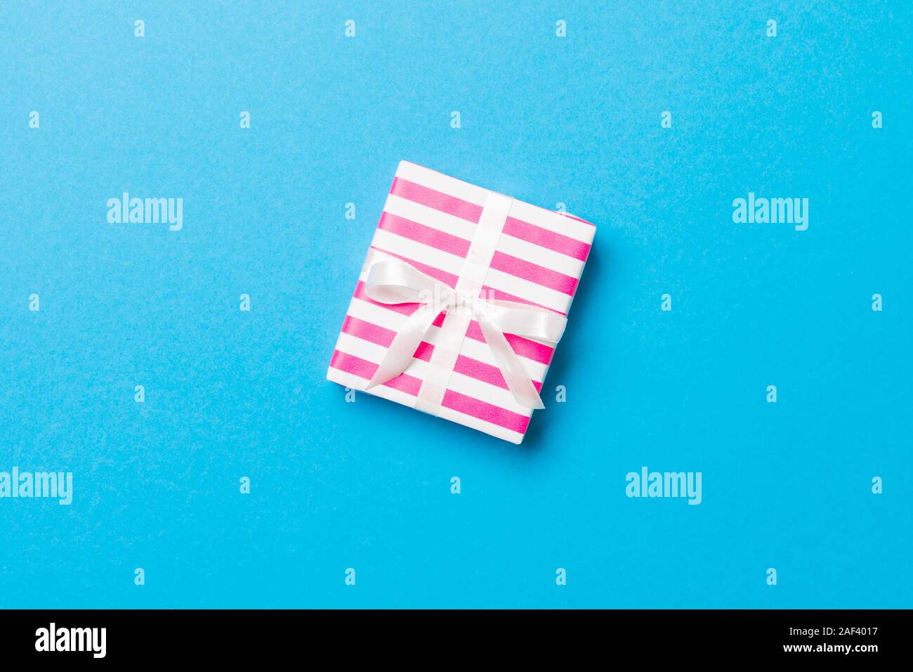 wrapped Christmas or other holiday handmade present in paper with white ...