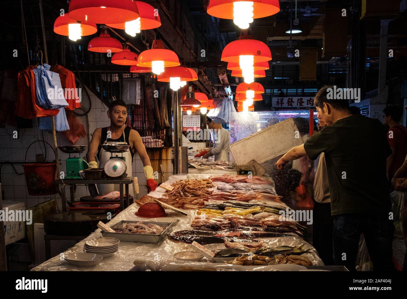 HongKong, China - November, 2019: People buying fish on food market in ...
