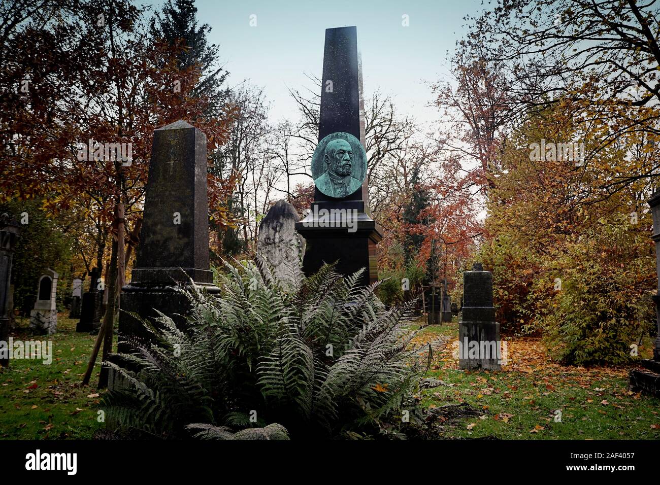 Munich, funerary monument with bronze medallion at Alter Nordfriedhof ...
