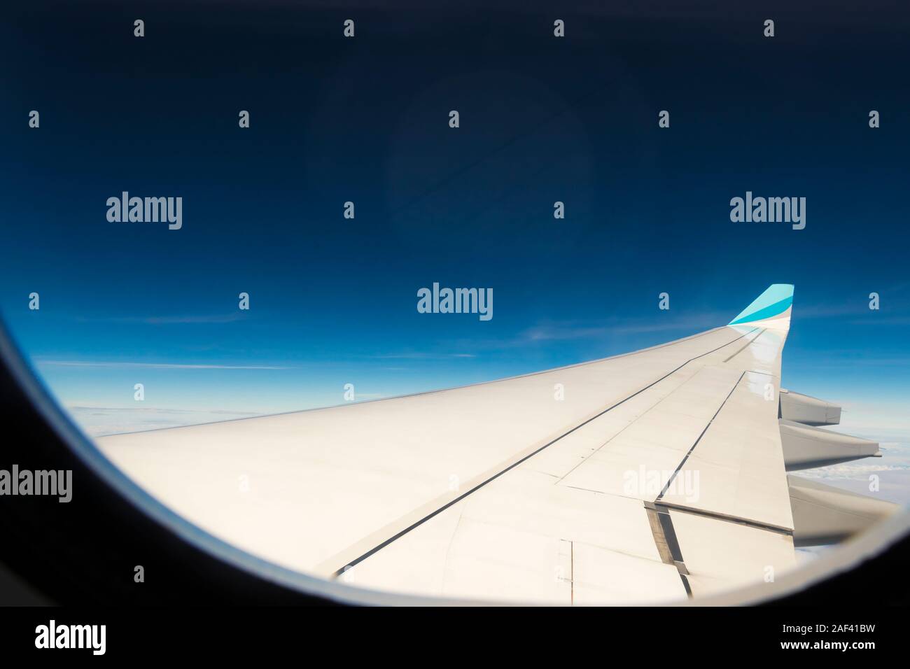 View out of an airplane window at high altitude Stock Photo - Alamy
