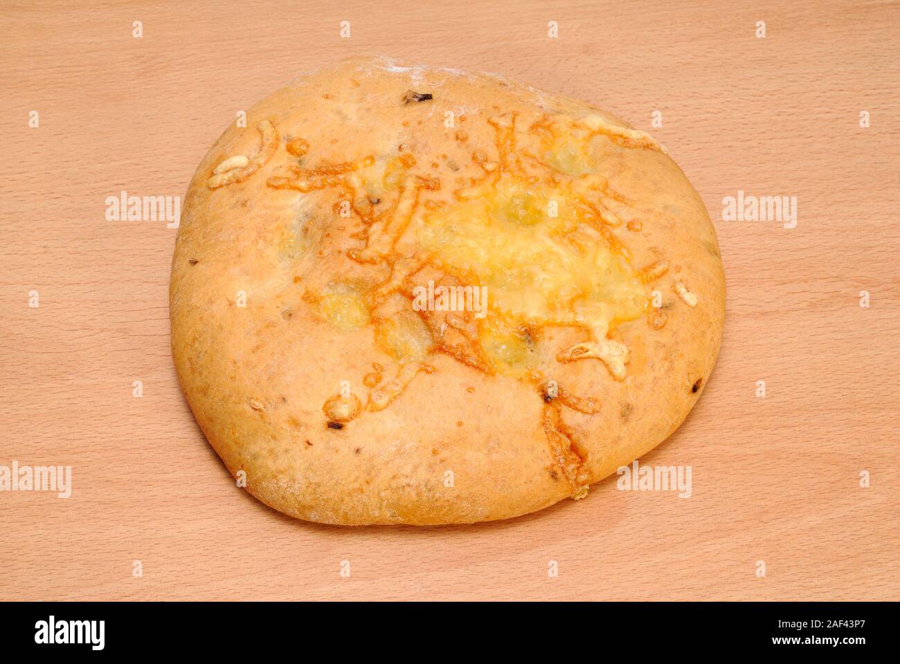 Round flat loaf of white bread with cheese Stock Photo - Alamy
