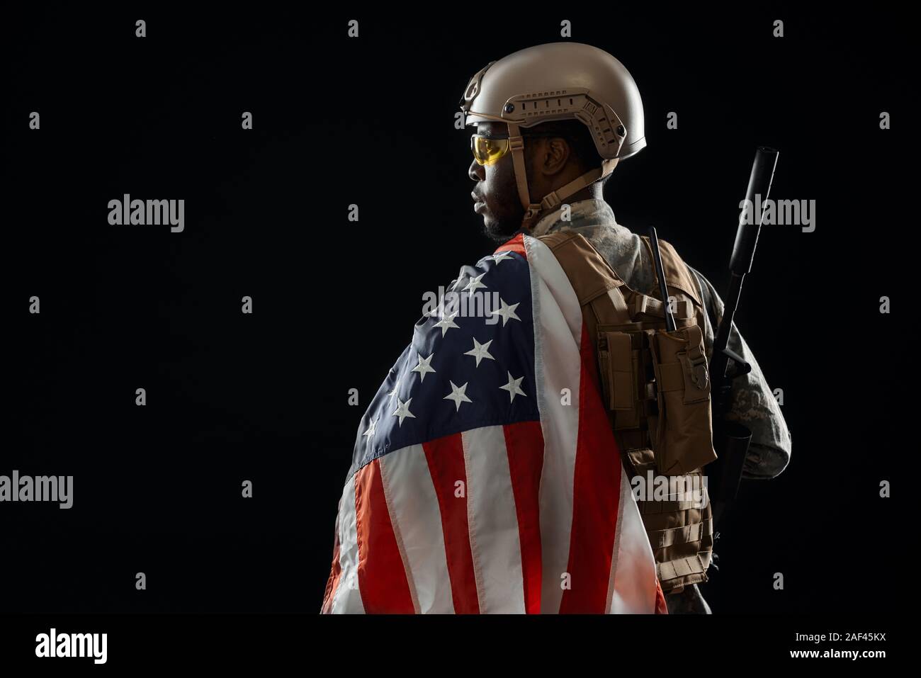 Back view holding gun on shoulder hi-res stock photography and images ...