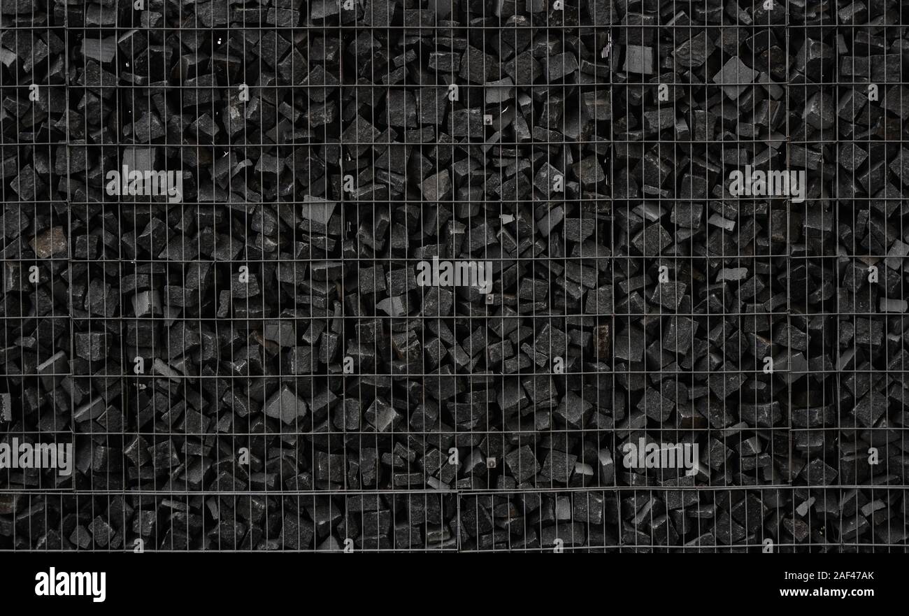 A stone wall that uses metal and stone in harmony. Ecology friendly ...