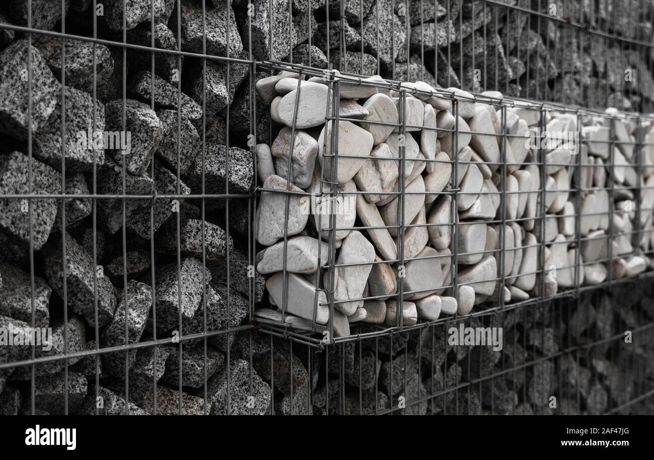 A stone wall that uses metal and stone in harmony. Ecology friendly ...